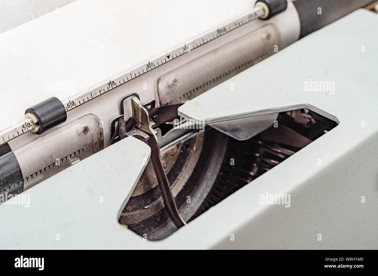 Carriage with letters in a mechanical typewriter. Letter pressed ...