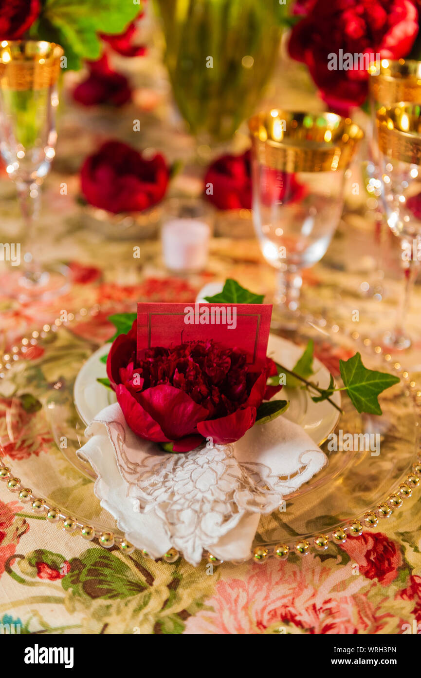 Fancy table setting with red flowers Stock Photo - Alamy