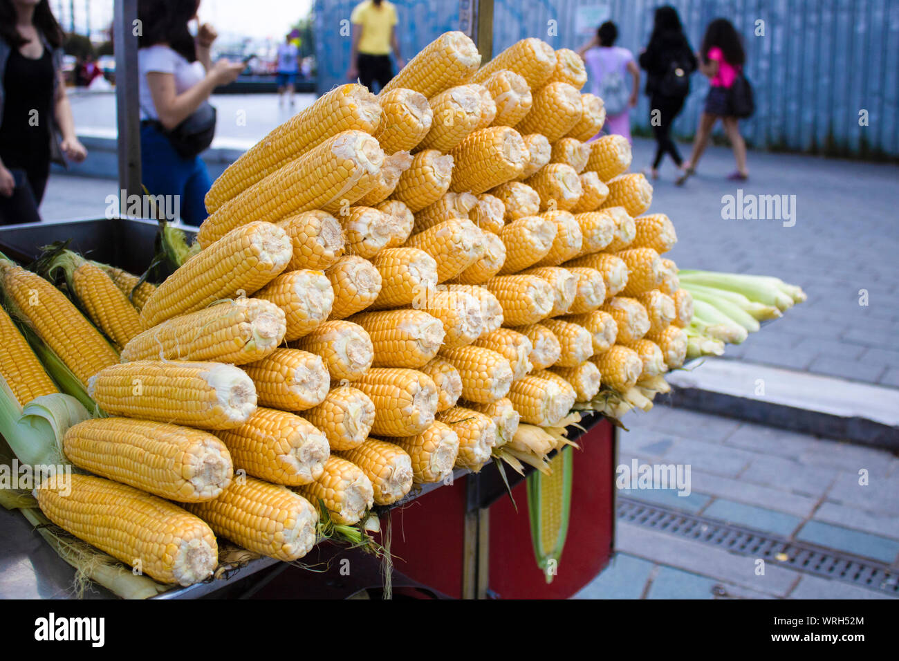 Bench selling boiled corn. Boiled corn and hot water in the boiler ...