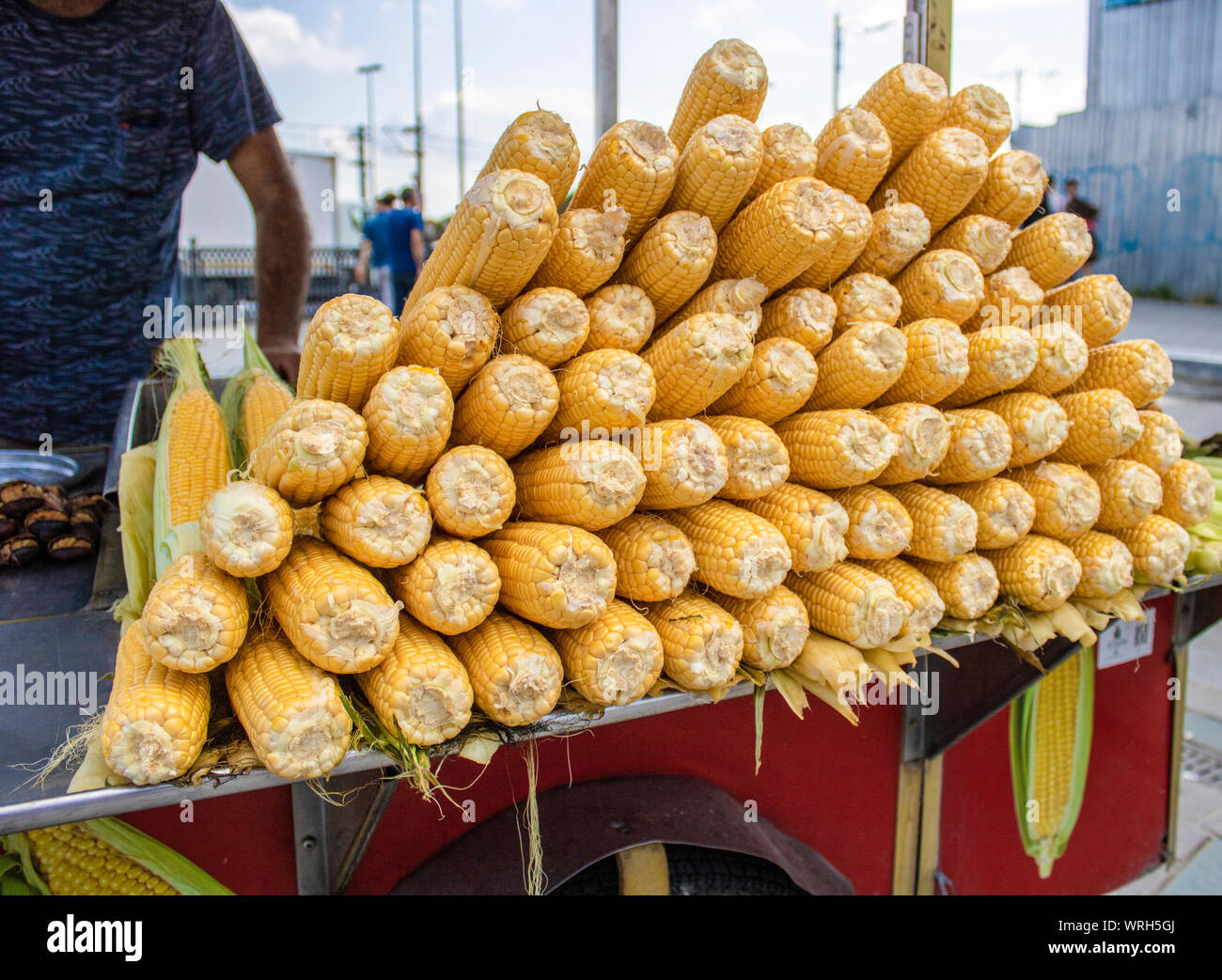 Bench selling boiled corn. Boiled corn and hot water in the boiler ...
