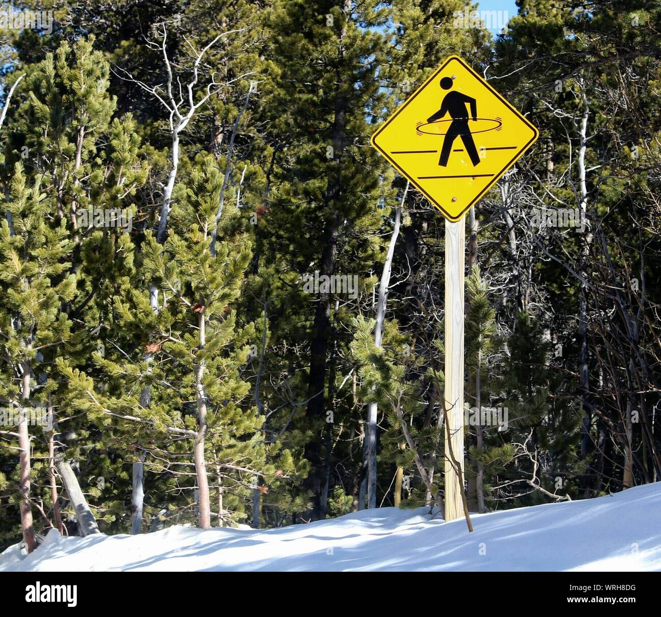 Tree covering sign hi-res stock photography and images - Alamy
