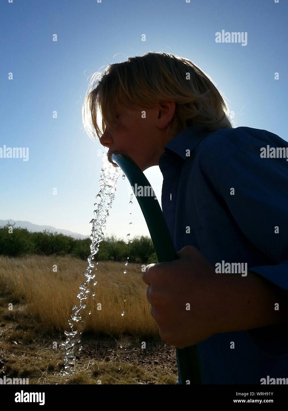 Boy falling into water hi-res stock photography and images - Alamy
