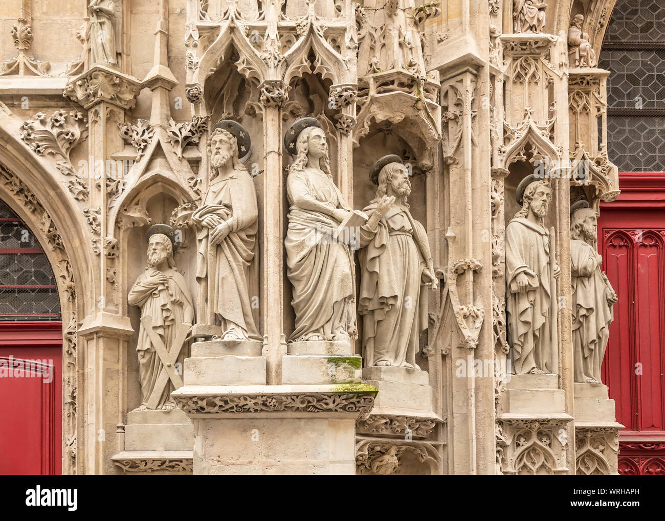 Statues of saints on the facade of the church of Saint-Merry. Paris ...