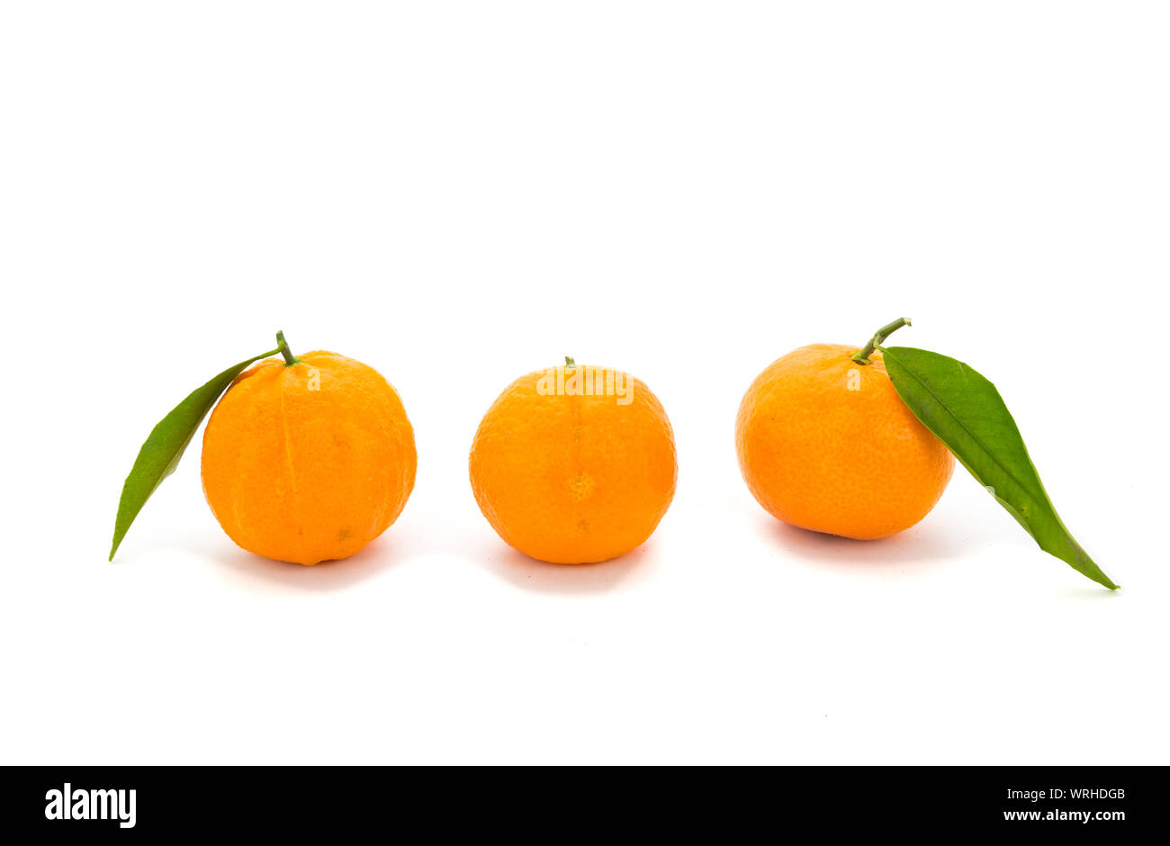 Three mandarins isolated on white background Stock Photo - Alamy