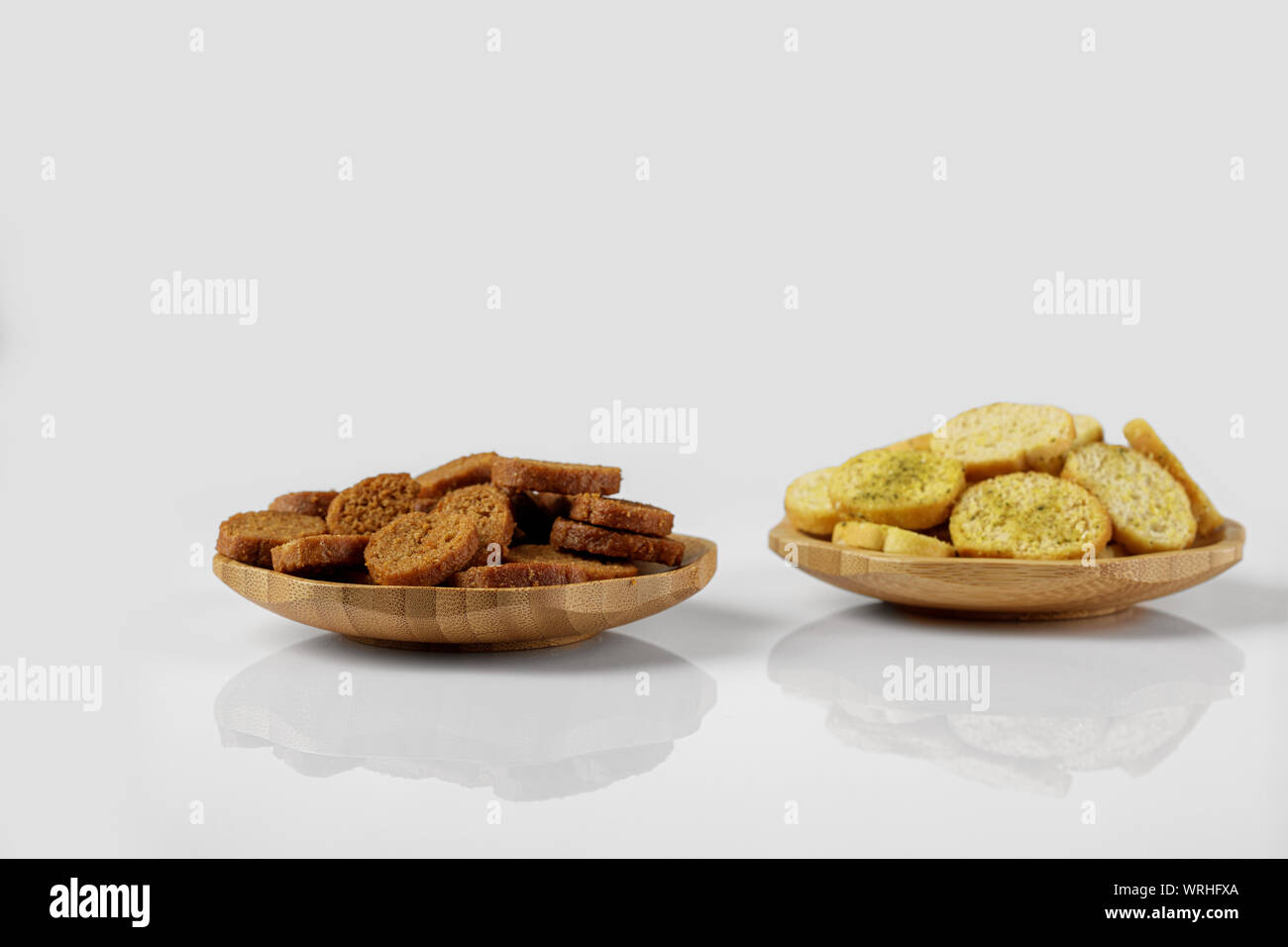 wood plate of crusty bread bruschetta on white background Stock Photo ...