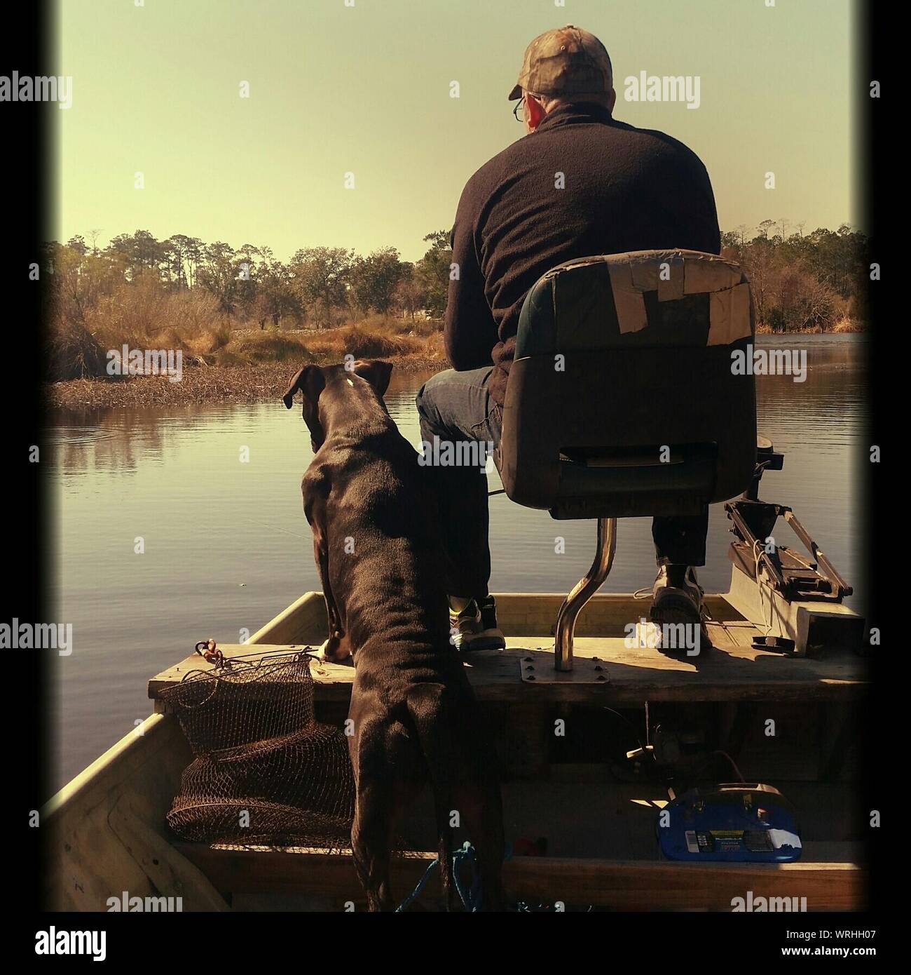 Man dog fishing hi-res stock photography and images - Alamy