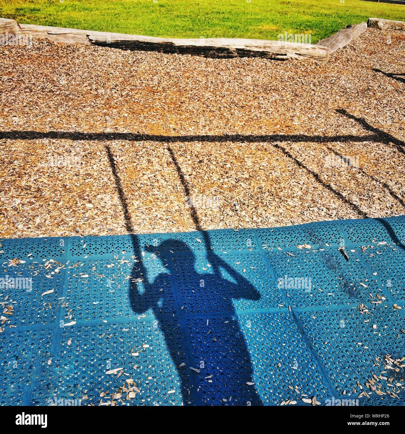 Shadow child on swing hi-res stock photography and images - Alamy