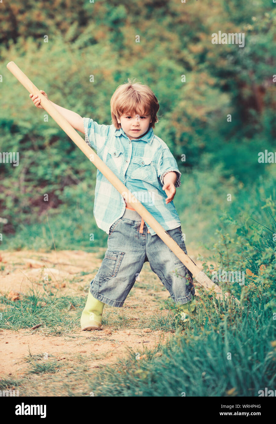 Adventure hunting for treasures. Little helper working in garden. Cute ...