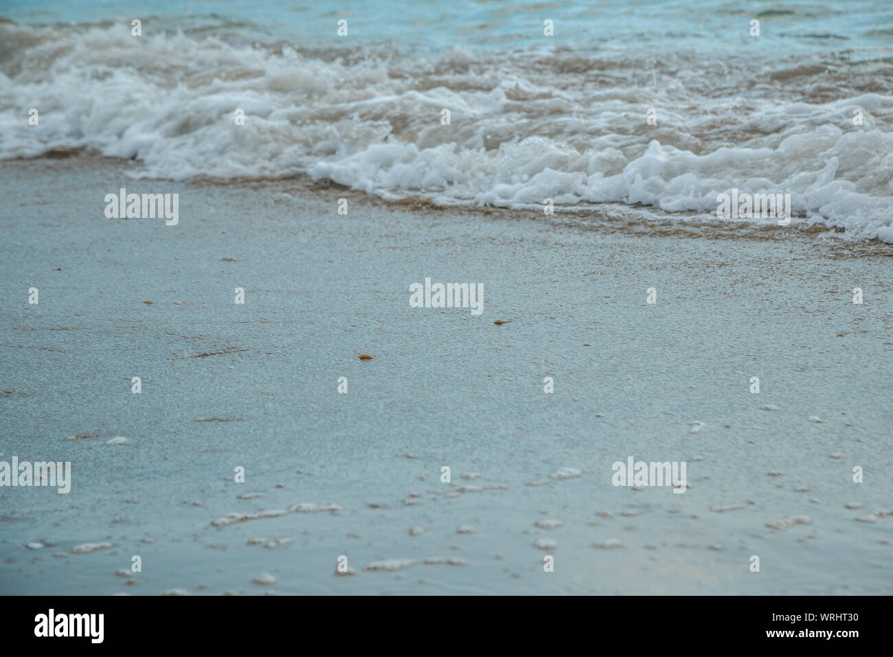background of waves beating on a sandy beach in stormy weather Stock ...