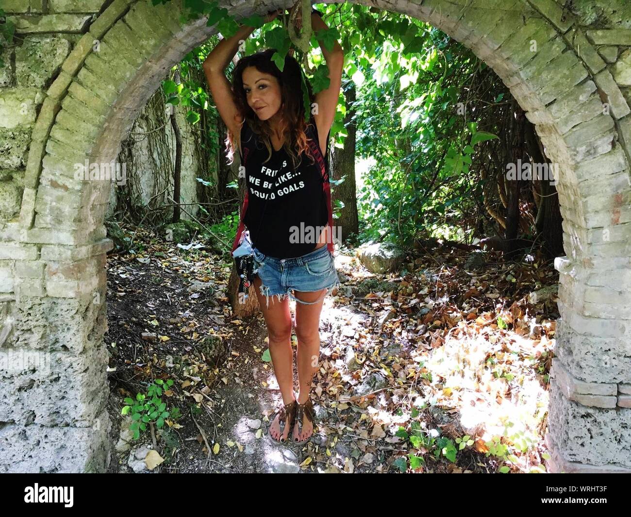 Woman standing in archway hi-res stock photography and images - Alamy