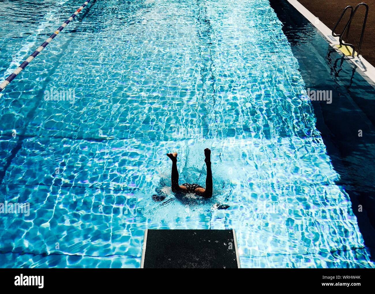 Man jumping swimming pool hi-res stock photography and images - Alamy