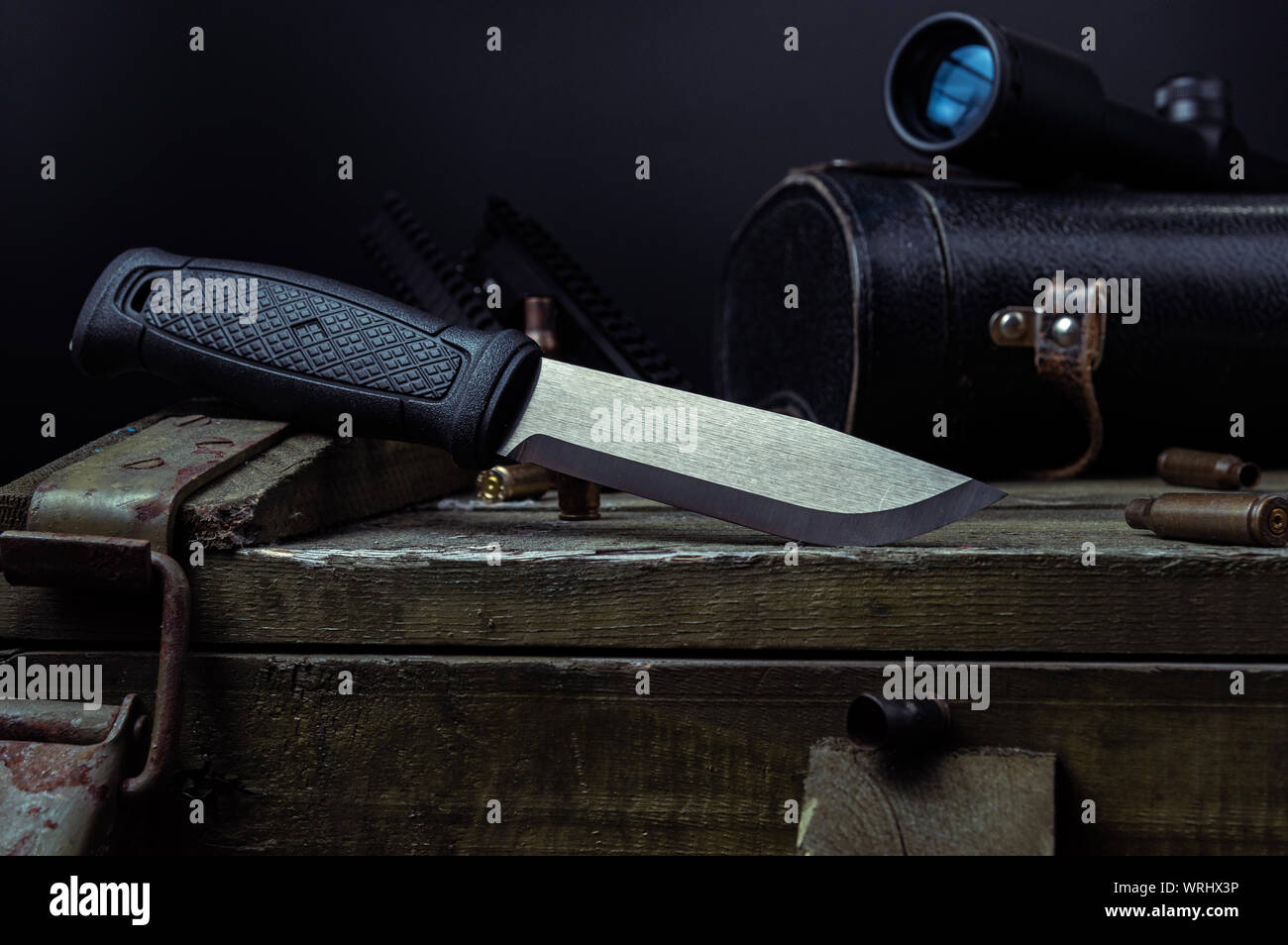 Black knife on an army green box. Knife closeup Stock Photo - Alamy