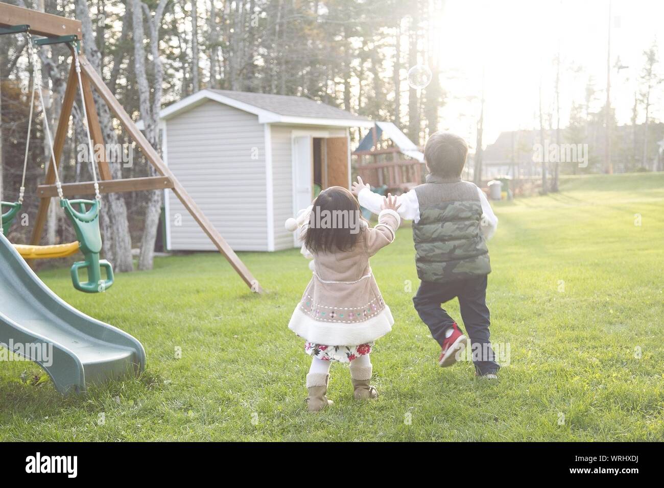 Children playing in playground hi-res stock photography and images - Alamy