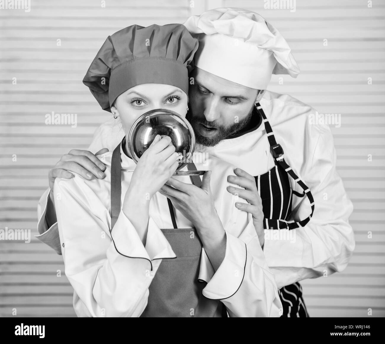 chefs compliment. man and woman chef in restaurant. couple in love with ...