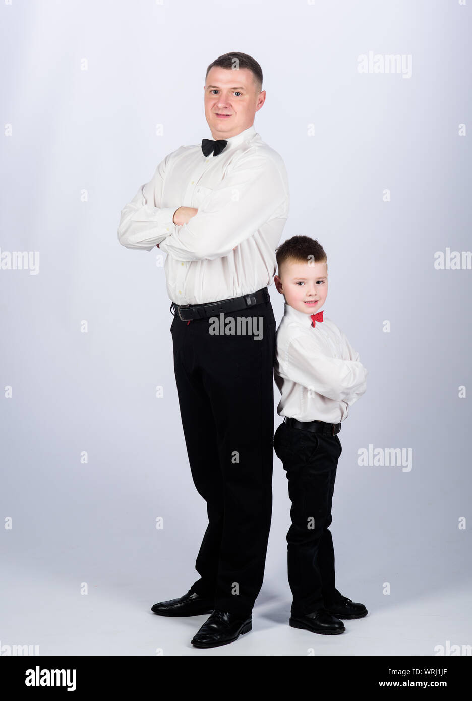 Little son following fathers example of noble man. Gentleman upbringing ...