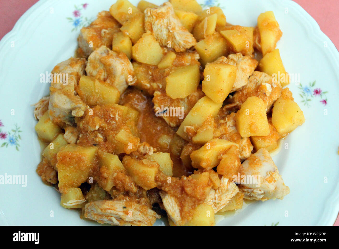 Beef stew in plate with potatoes. Romanian cuisine tocanita Stock Photo ...