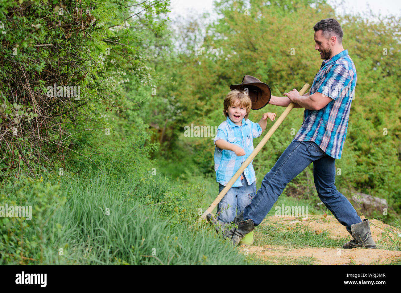 Spirit of adventures. Little helper in garden. Child having fun cowboy ...