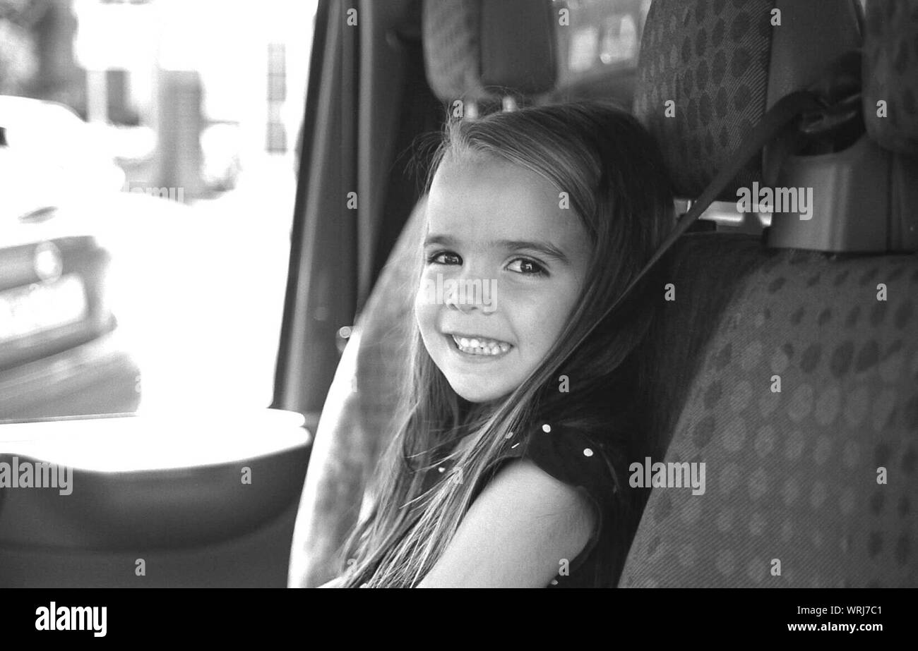 Side view girl in car seat hi-res stock photography and images - Alamy