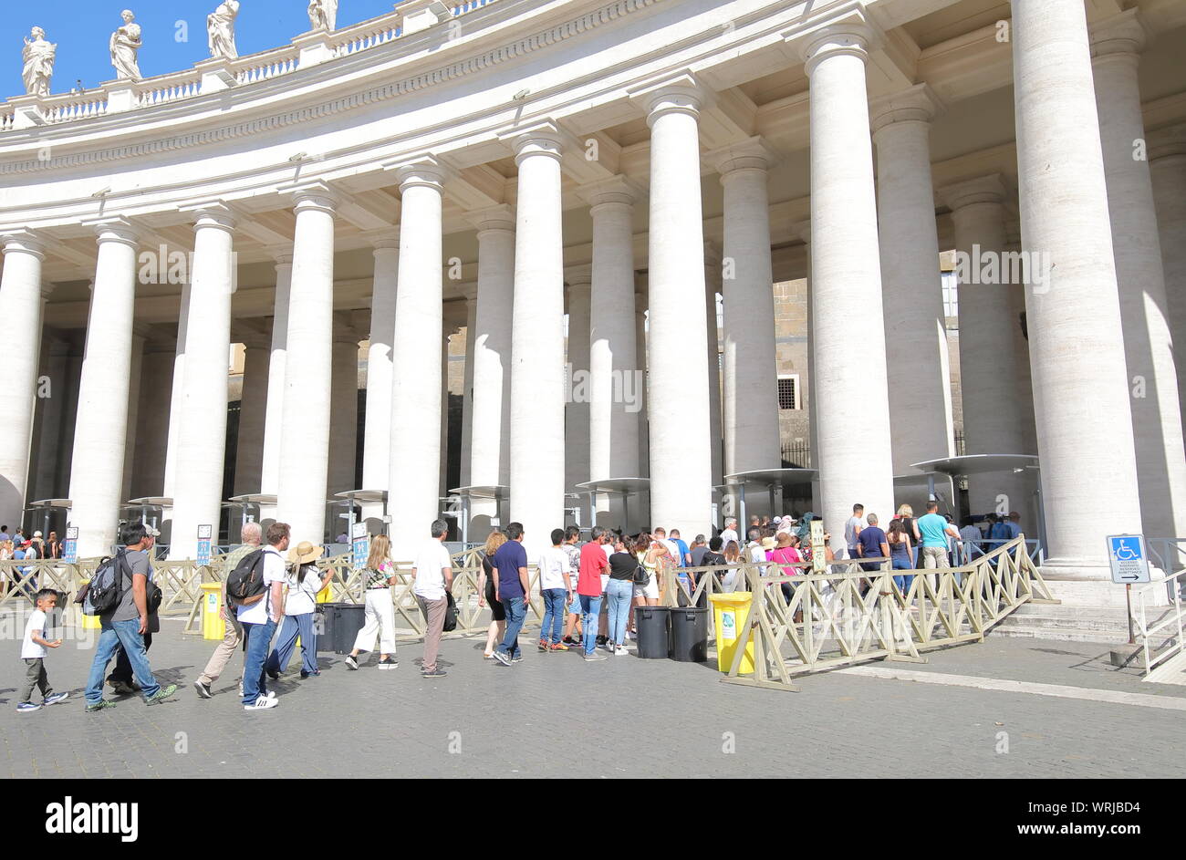 People go through security check at St Peters basilica Vatican city ...
