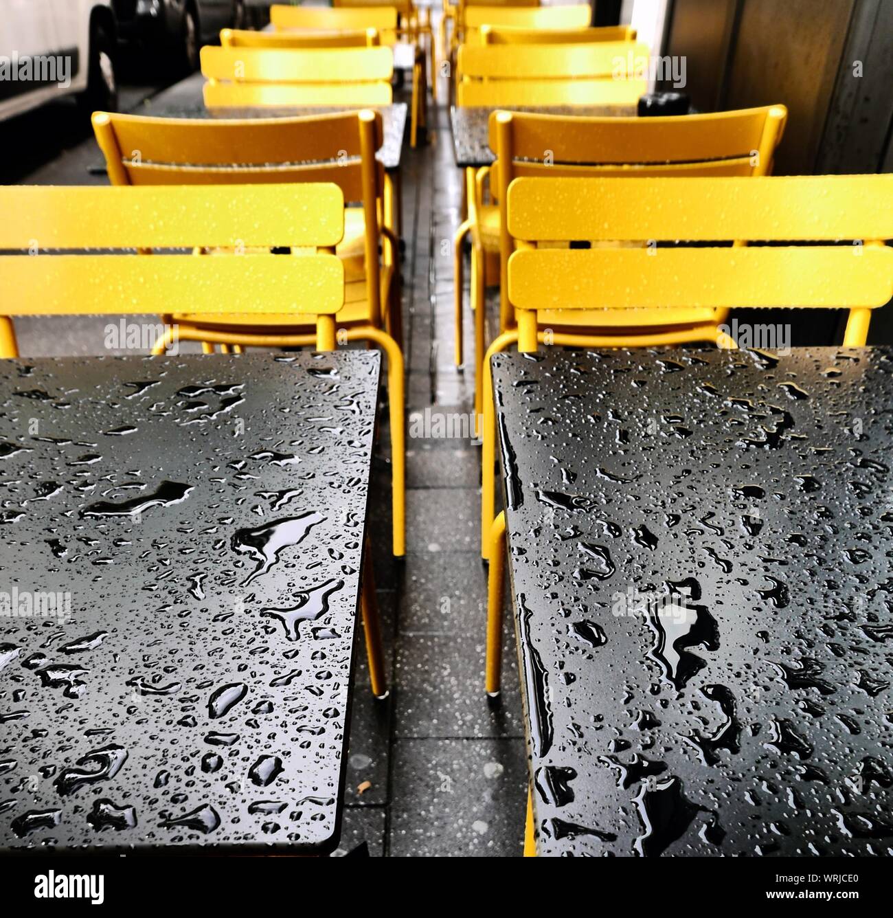 Wet tables and chairs hi-res stock photography and images - Alamy