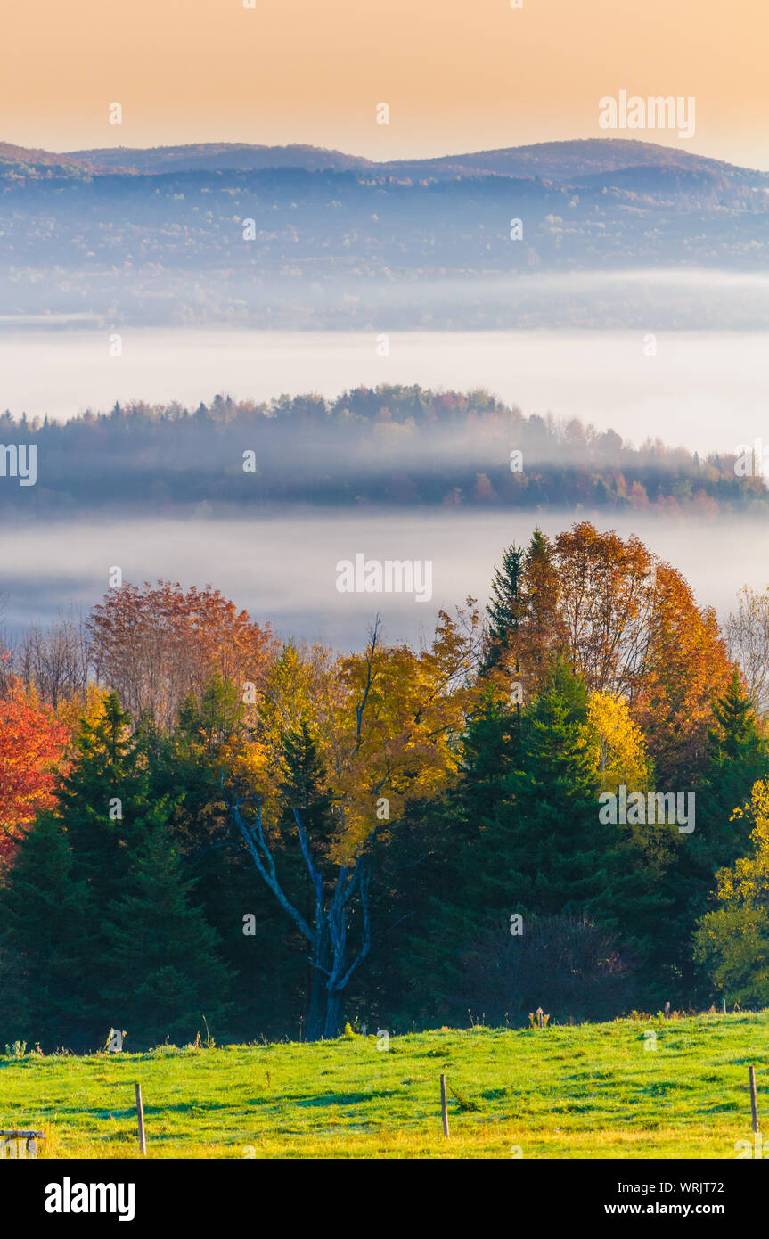 Landscape view of a morning sunrise during fall foliage season, Stowe ...