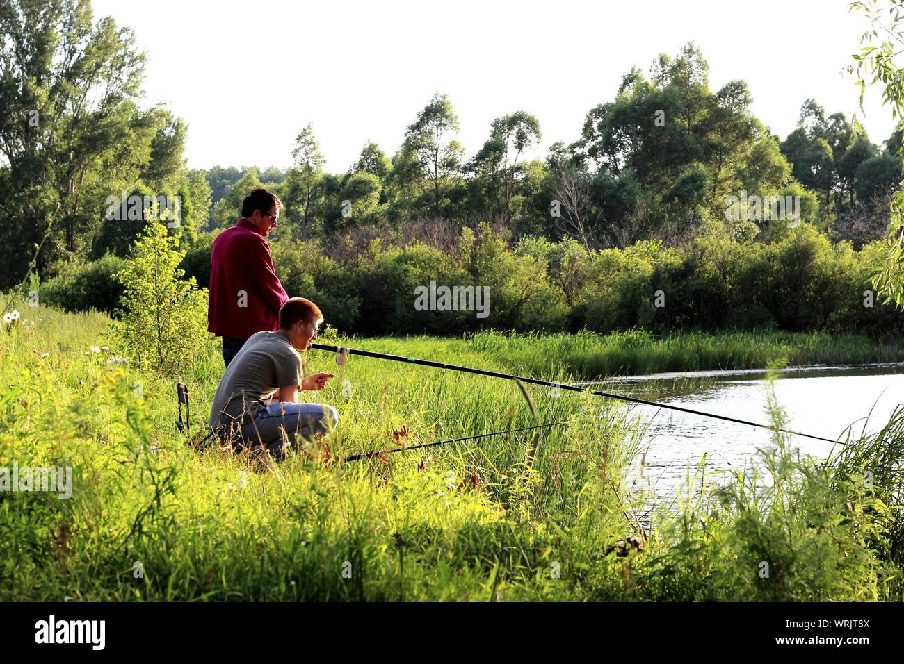 Two men fishing lake in hi-res stock photography and images - Alamy