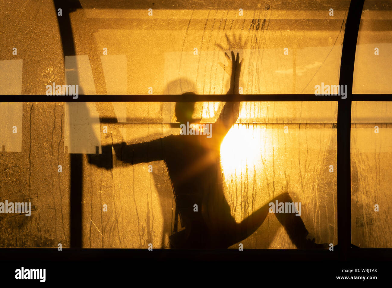 Silhouette woman in shelter hi-res stock photography and images - Alamy