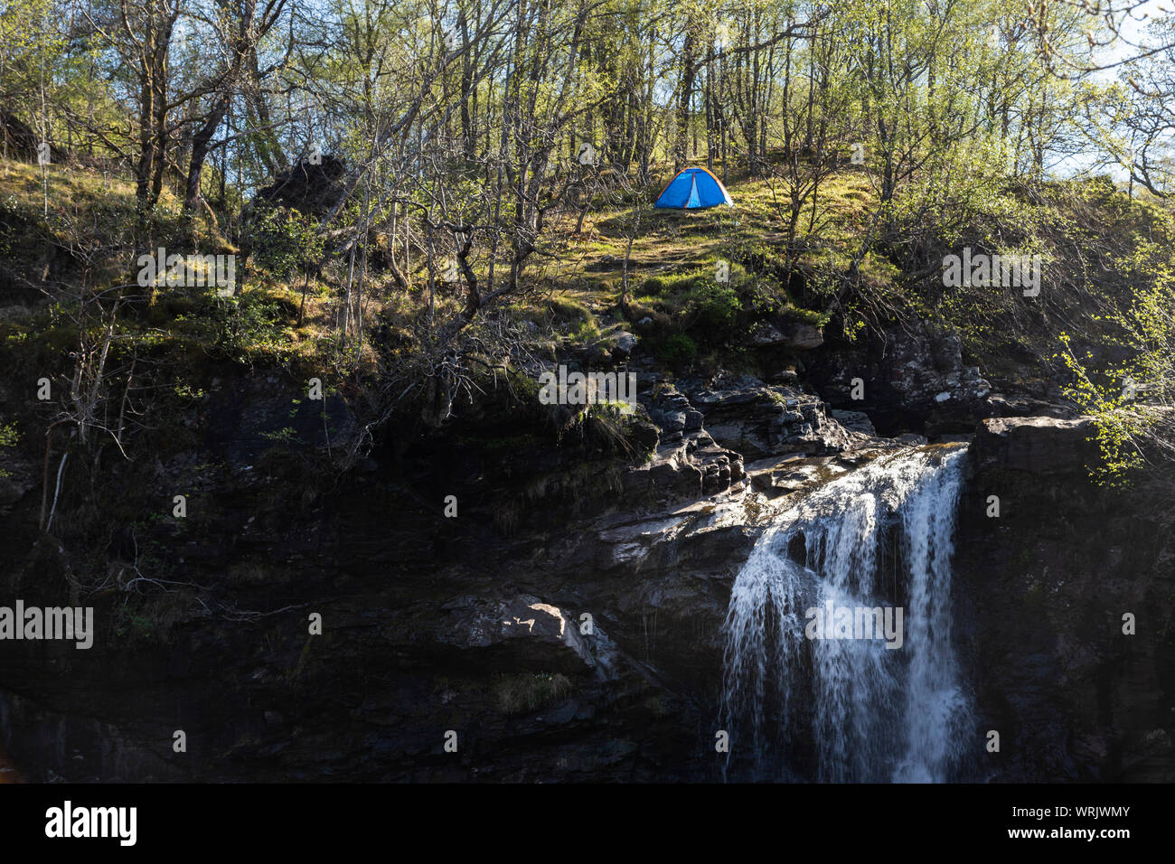 tent piched at the top of the falls of falloch Stock Photo - Alamy