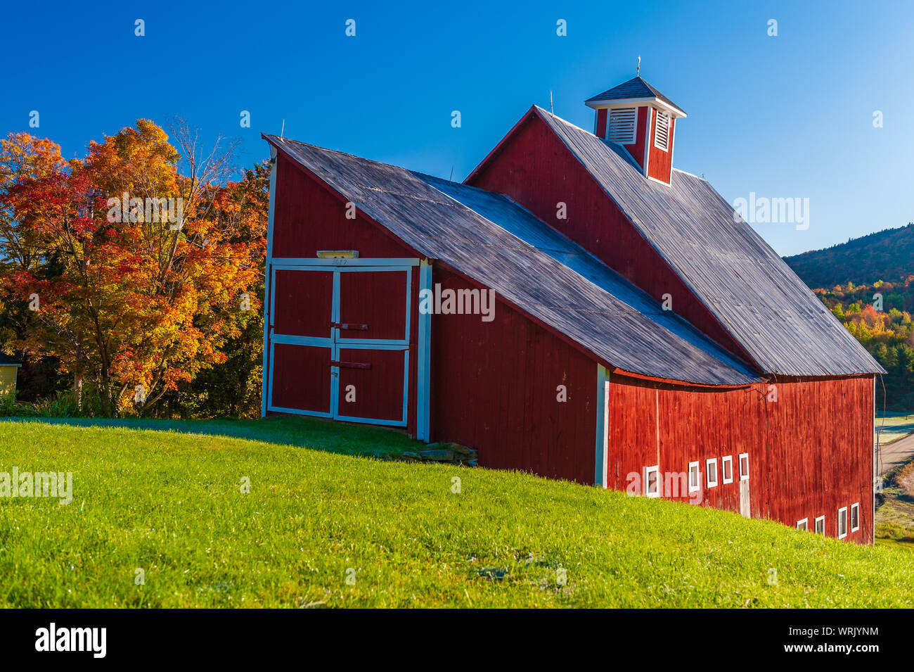 Red barn during a New England fall foliage, Stowe, Vermont, USA Stock ...