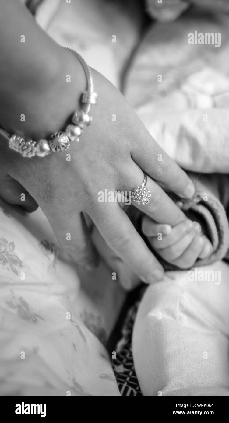 Baby hand holding finger ring hi-res stock photography and images - Alamy