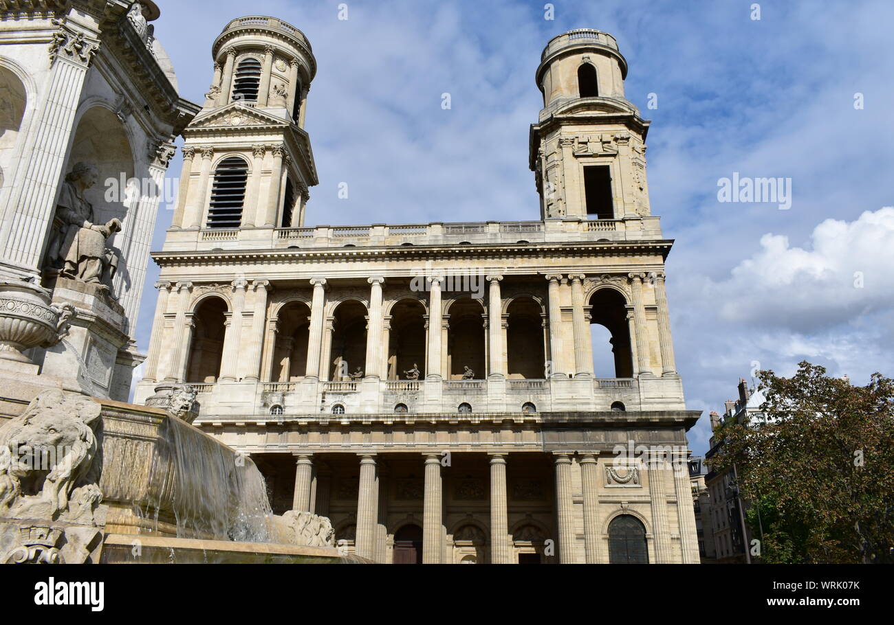 Church of Saint Sulpice neoclassical facade with fountain. Paris ...