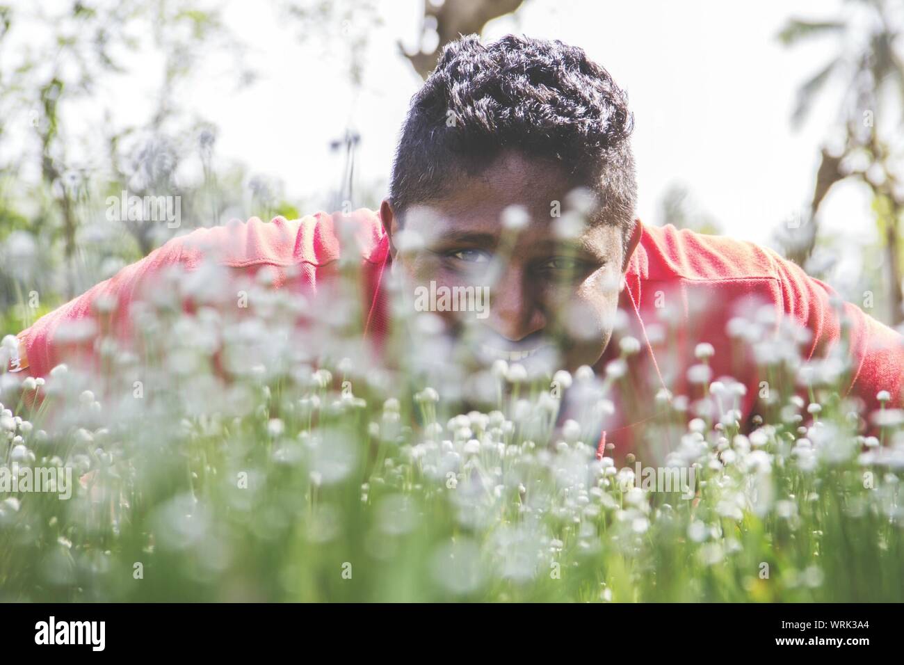 Man hiding flowers hi-res stock photography and images - Alamy