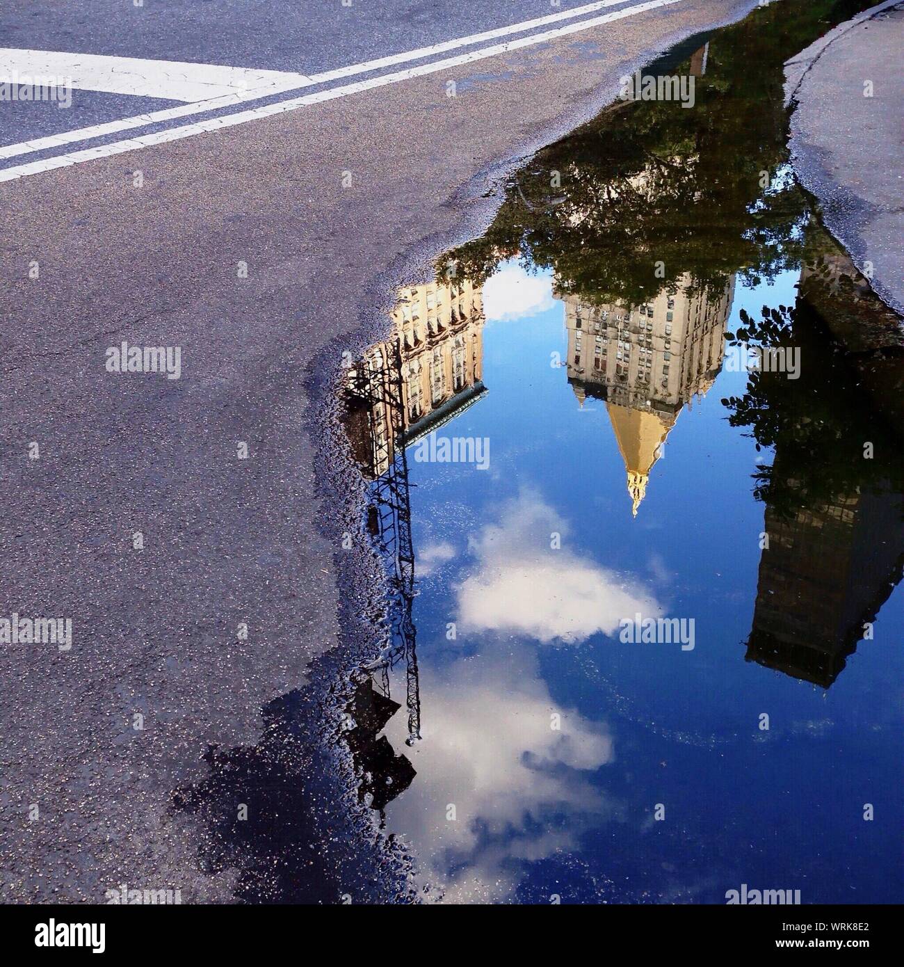 Reflection Of Building In Puddle Stock Photo - Alamy