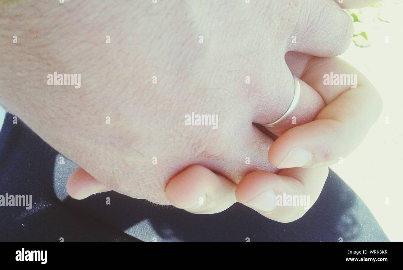 Hands interlocked hi-res stock photography and images - Alamy