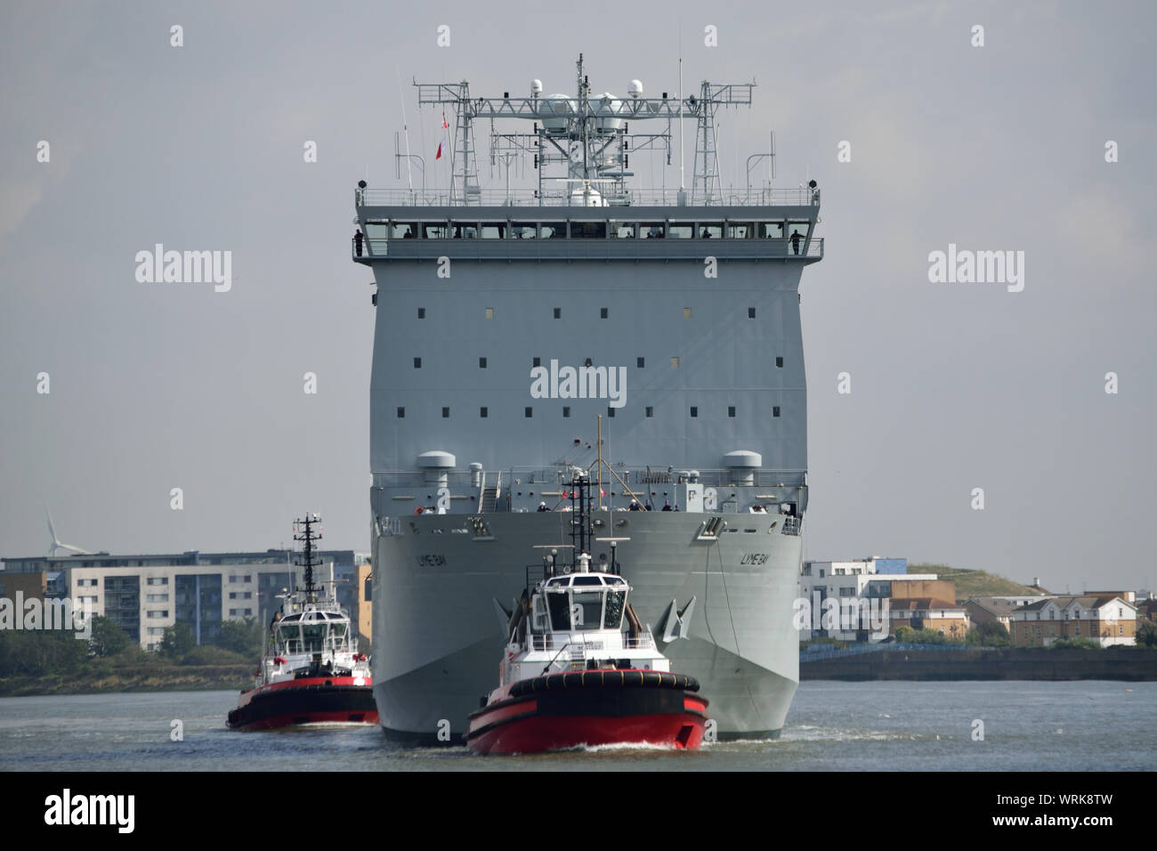 Royal Fleet Auxiliary ship RFA Lyme Bay arriving on the River Thames on ...