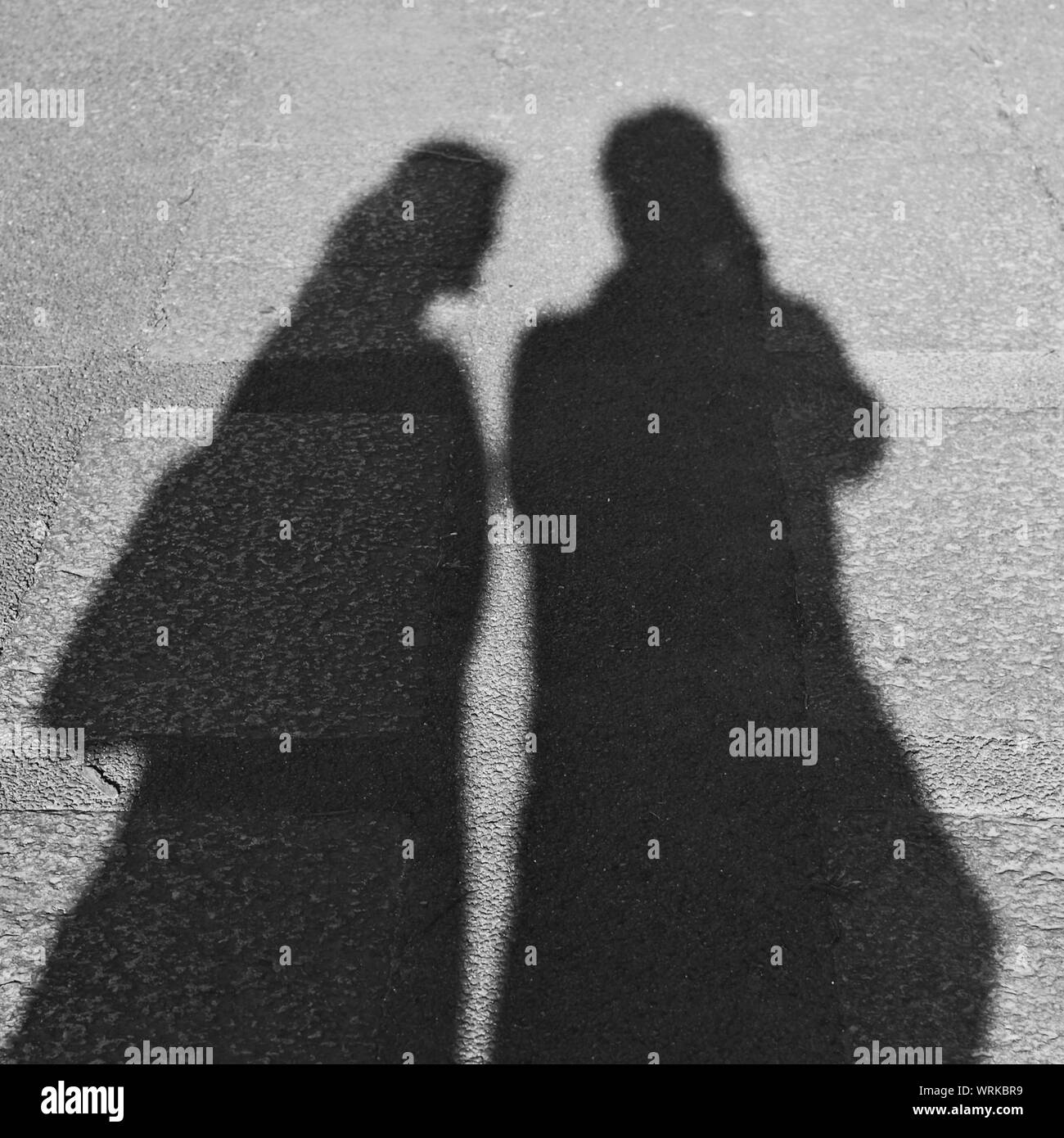 Shadow Of Friends On Street Stock Photo - Alamy