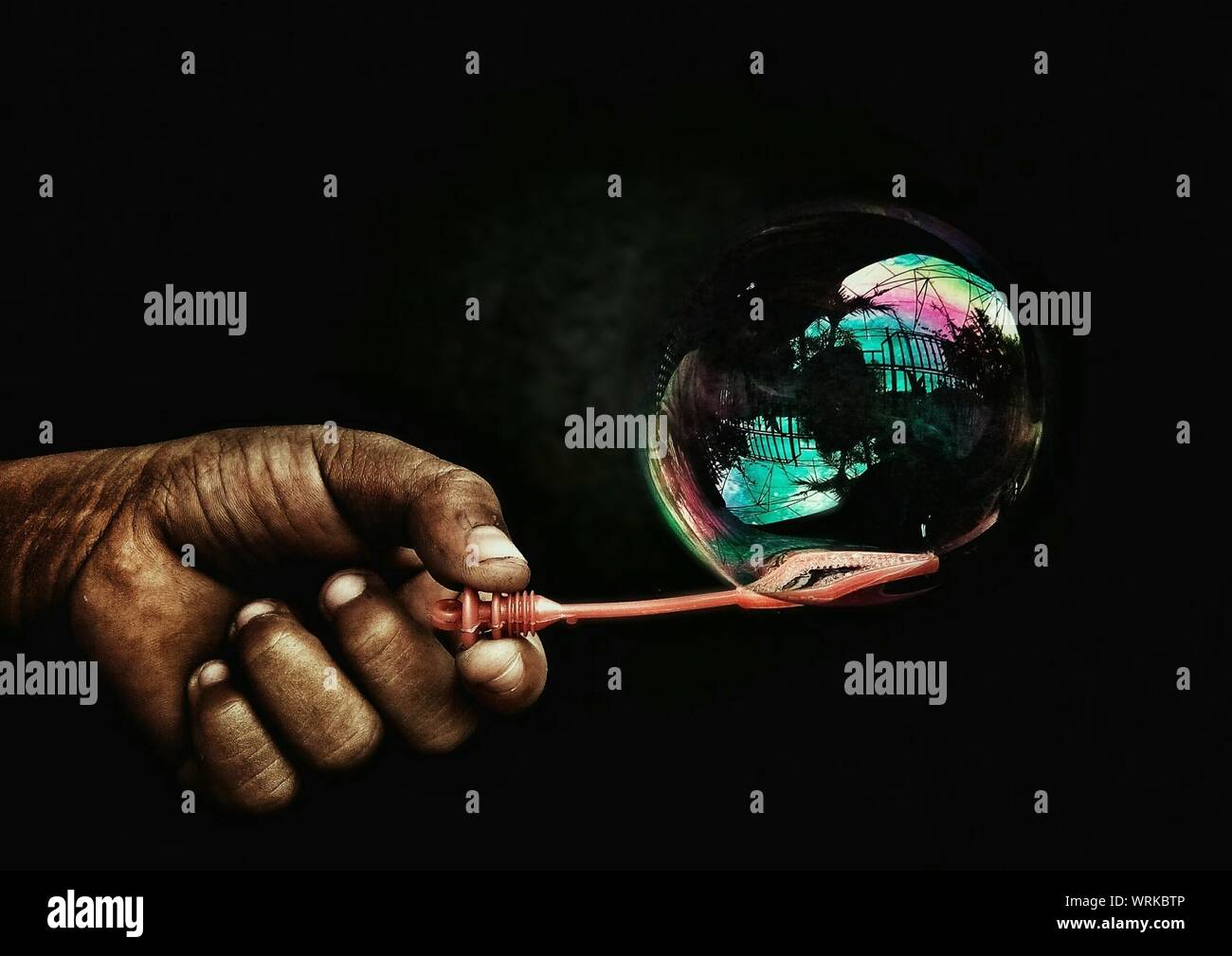 Hand holding bubble wand hi-res stock photography and images - Alamy