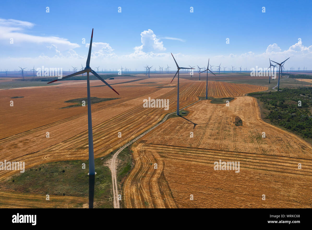 Eolian field and wind turbines farm on countryside in a sunny day Stock ...