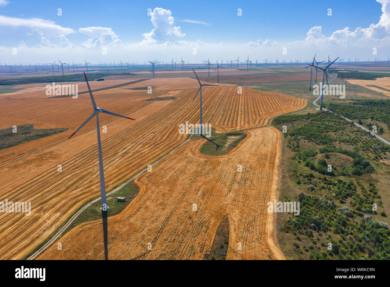 Eolian field and wind turbines farm on countryside in a sunny day Stock ...