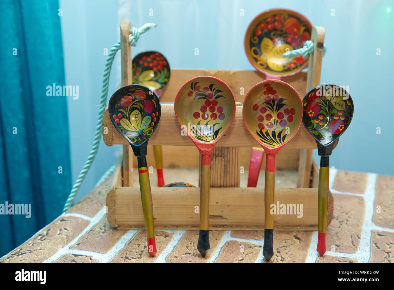 russian table with samovar tea and wooden spoons near by . russian ...
