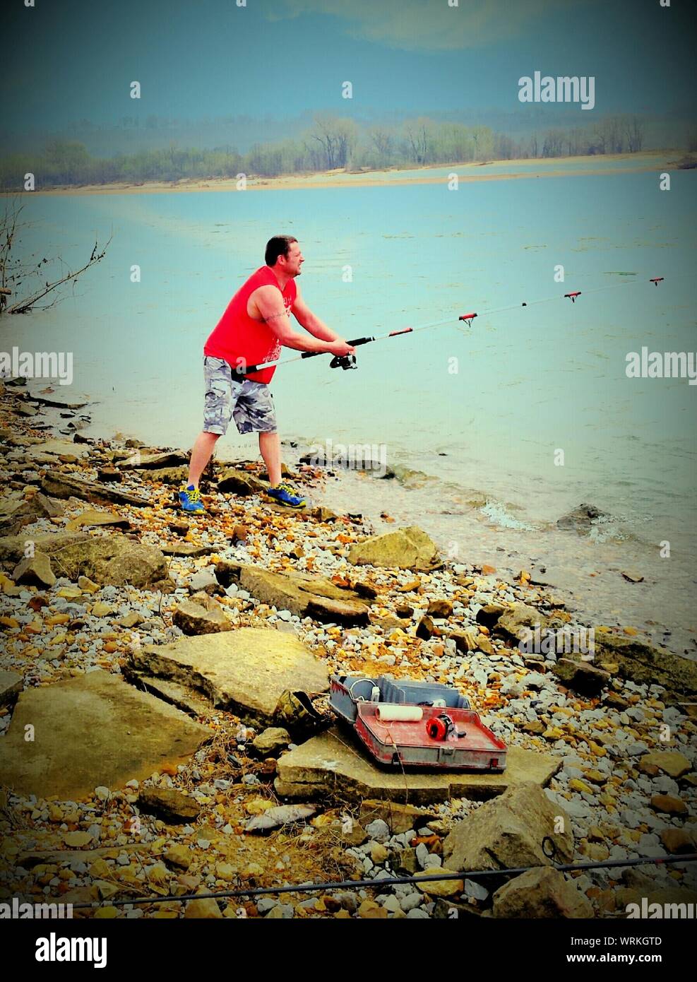 Full Length Of Man Fishing In River Stock Photo - Alamy