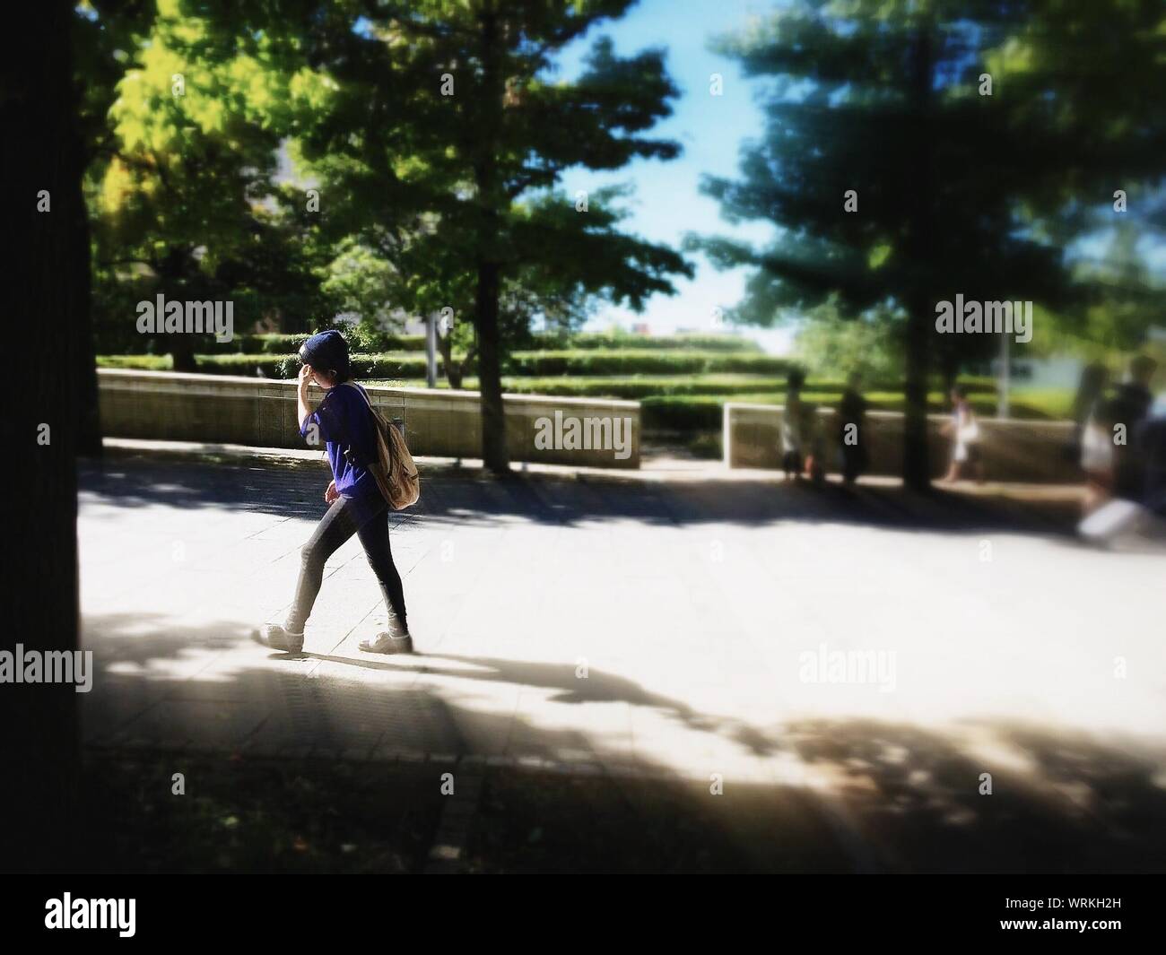Man walking side view sunlight hi-res stock photography and images - Alamy
