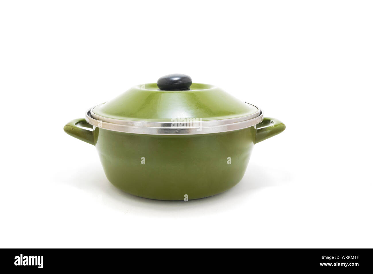 Used green cast iron cooking pot, isolated on white background Stock ...