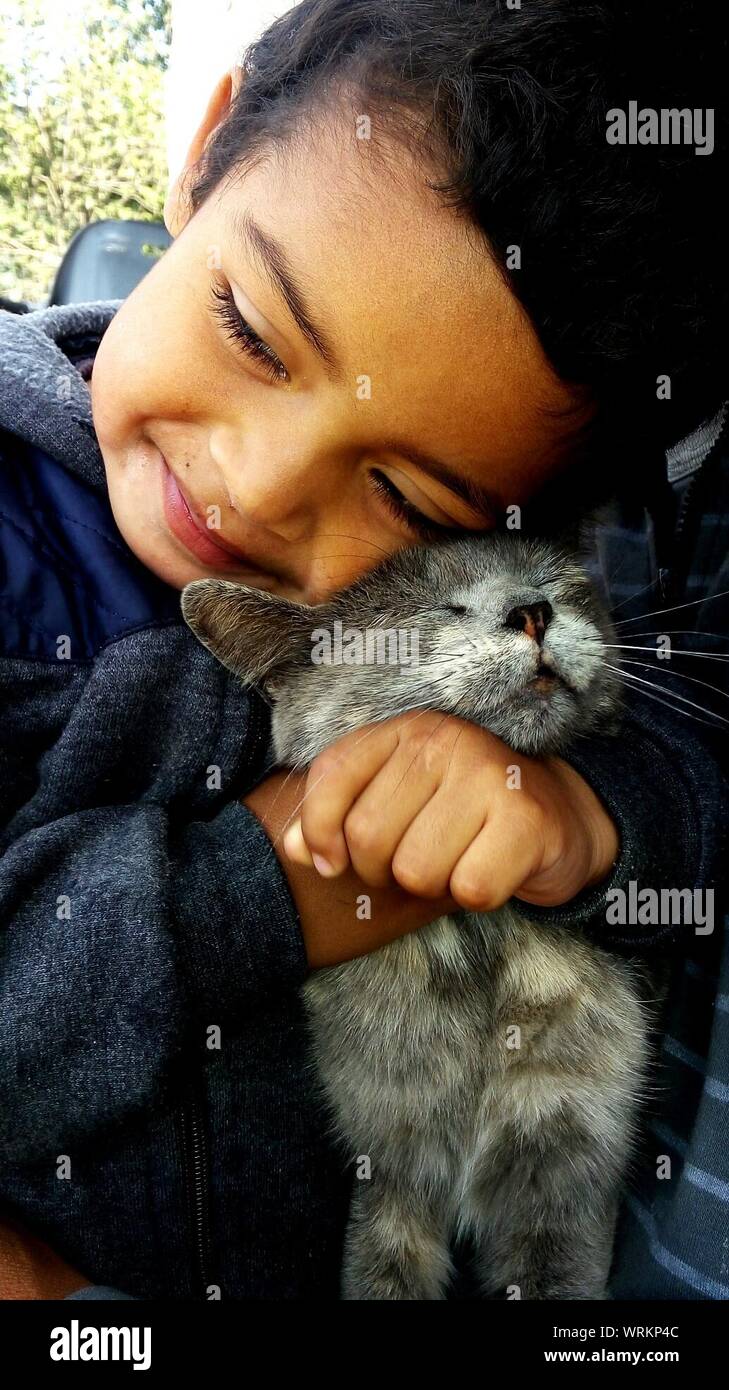 Boy Hugging Cat High Resolution Stock Photography and Images - Alamy