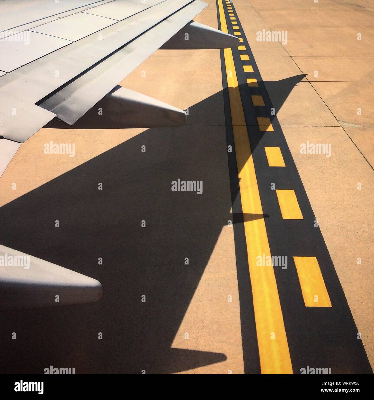 Airplane shadow on runway hi-res stock photography and images - Alamy