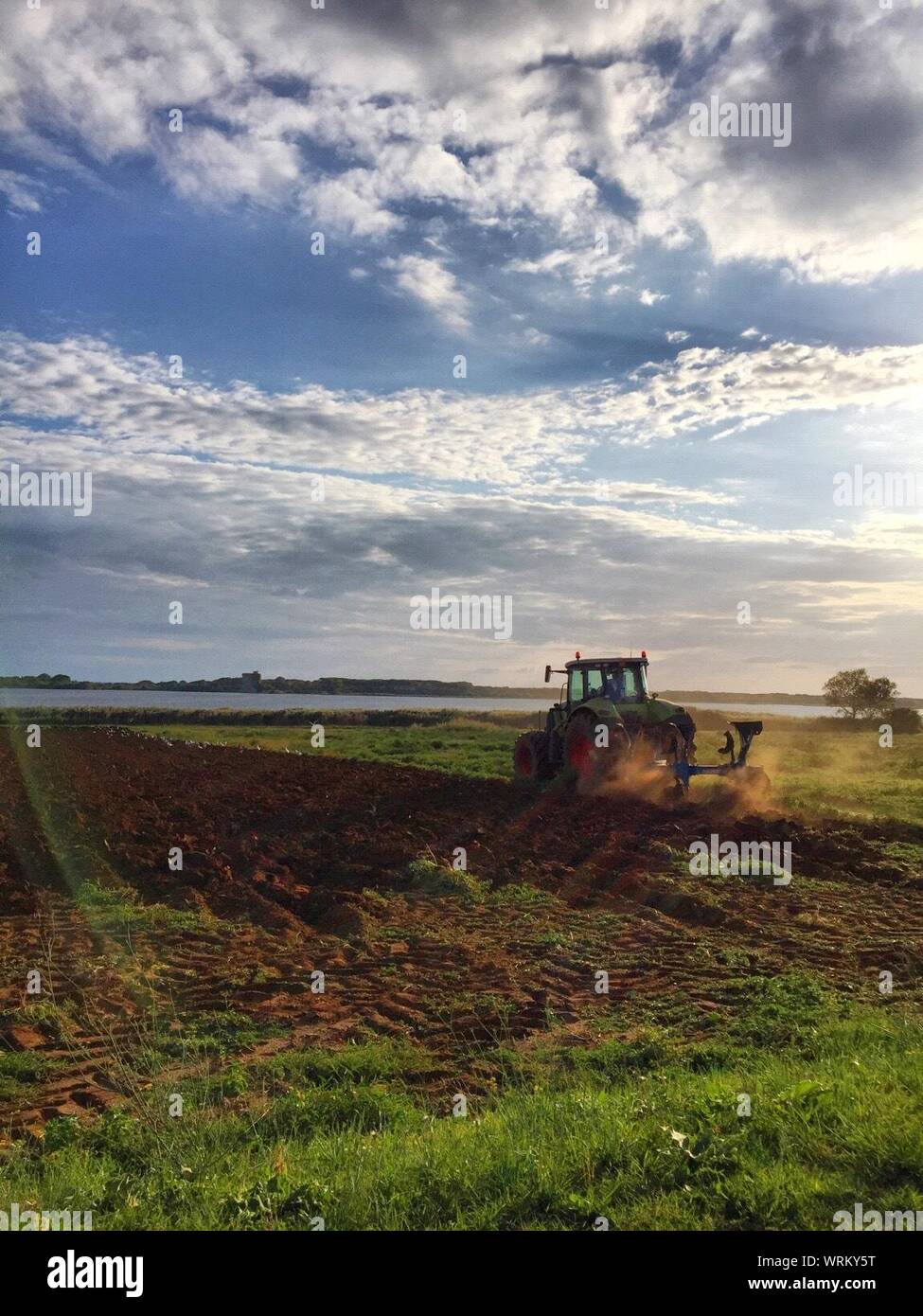 Working on tractor hi-res stock photography and images - Alamy