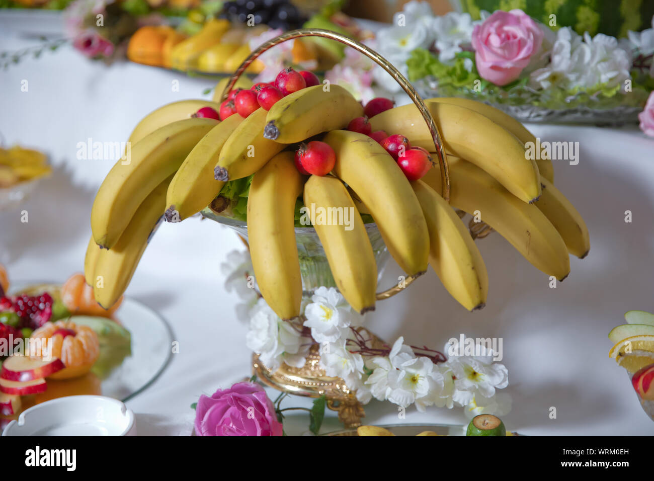 It lay on the stainless plate in outdoor .inside uncooked bananas and ...