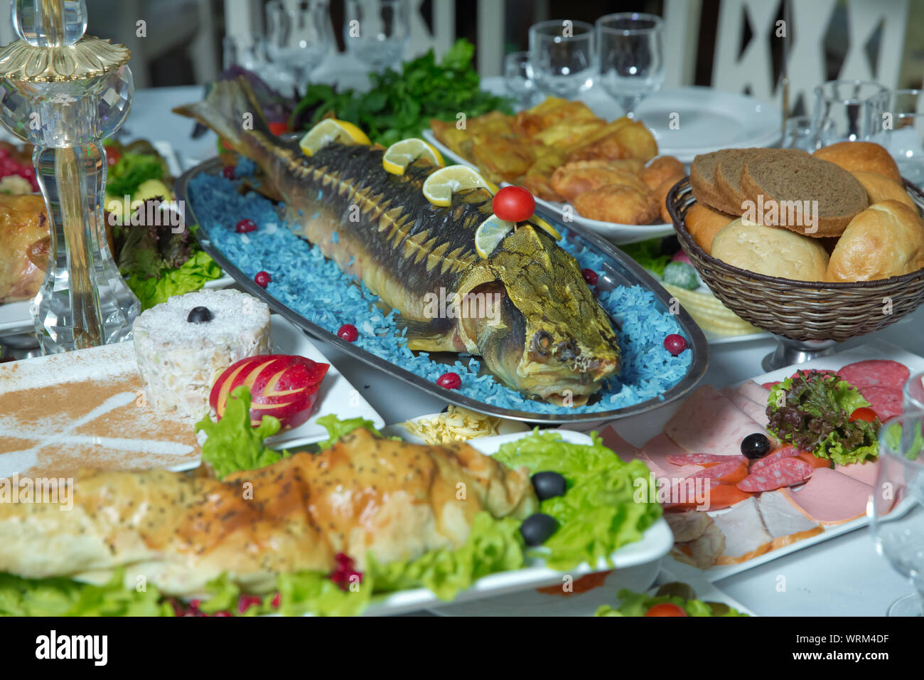 Cooked fish is on the table .Grilled sturgeon fish. Grilled sturgeon ...