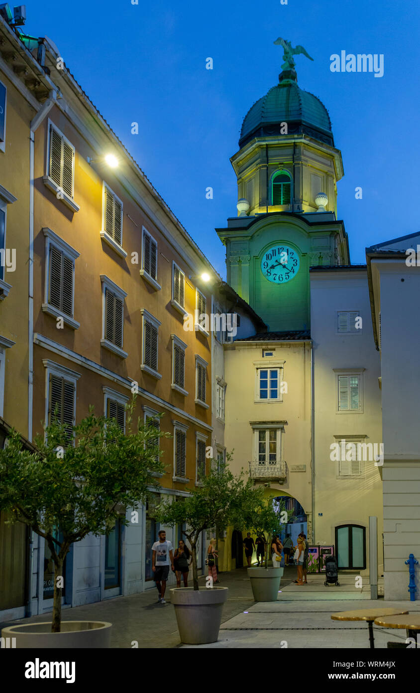 An evening view of the The Baroque Rijeka city clock tower as seen from ...