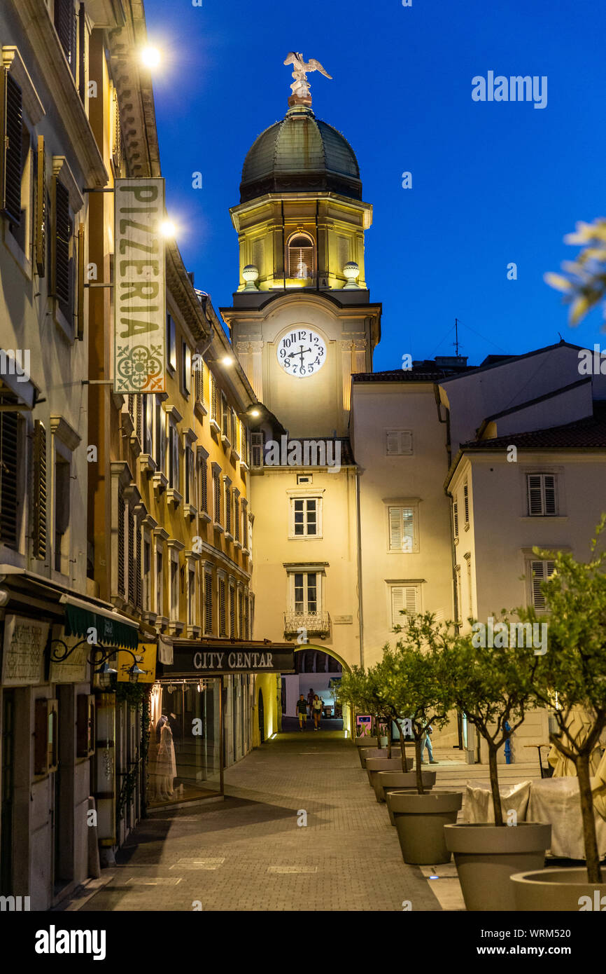 An evening view of the The Baroque Rijeka city clock tower as seen from ...